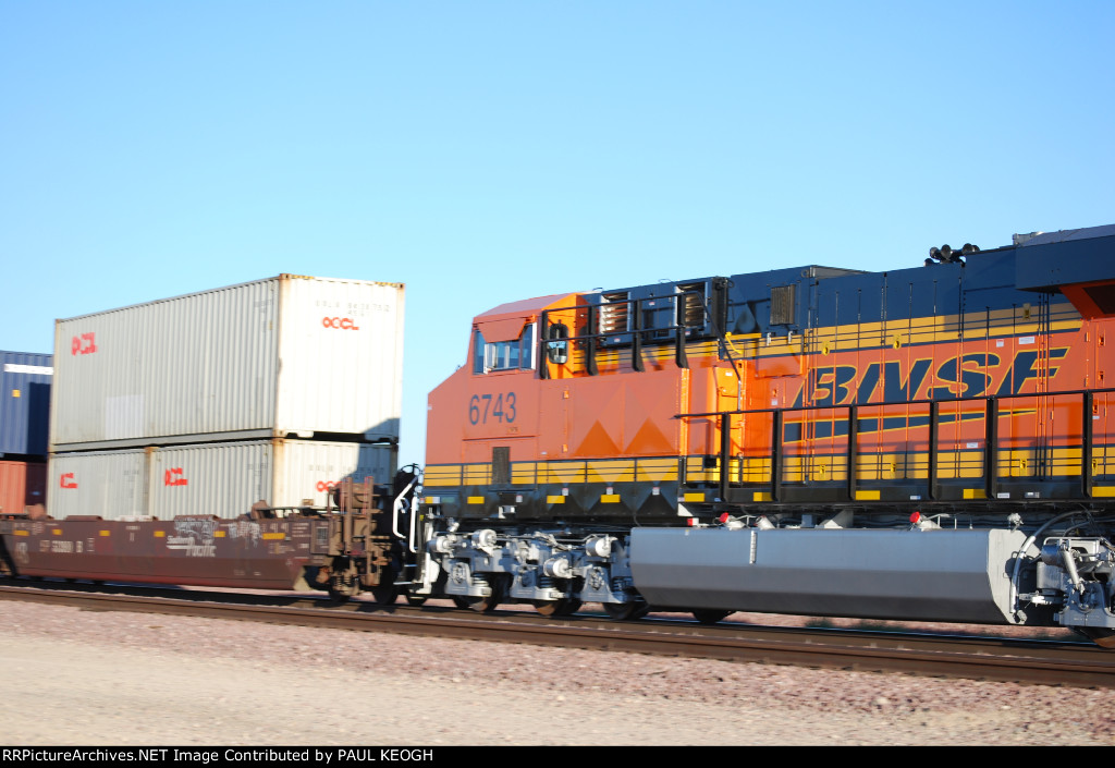 With the Rising Sun's Rays Glistening Off Her Very Brand New BNSF Swoosh Logo BNSF 6743 pushes a ...